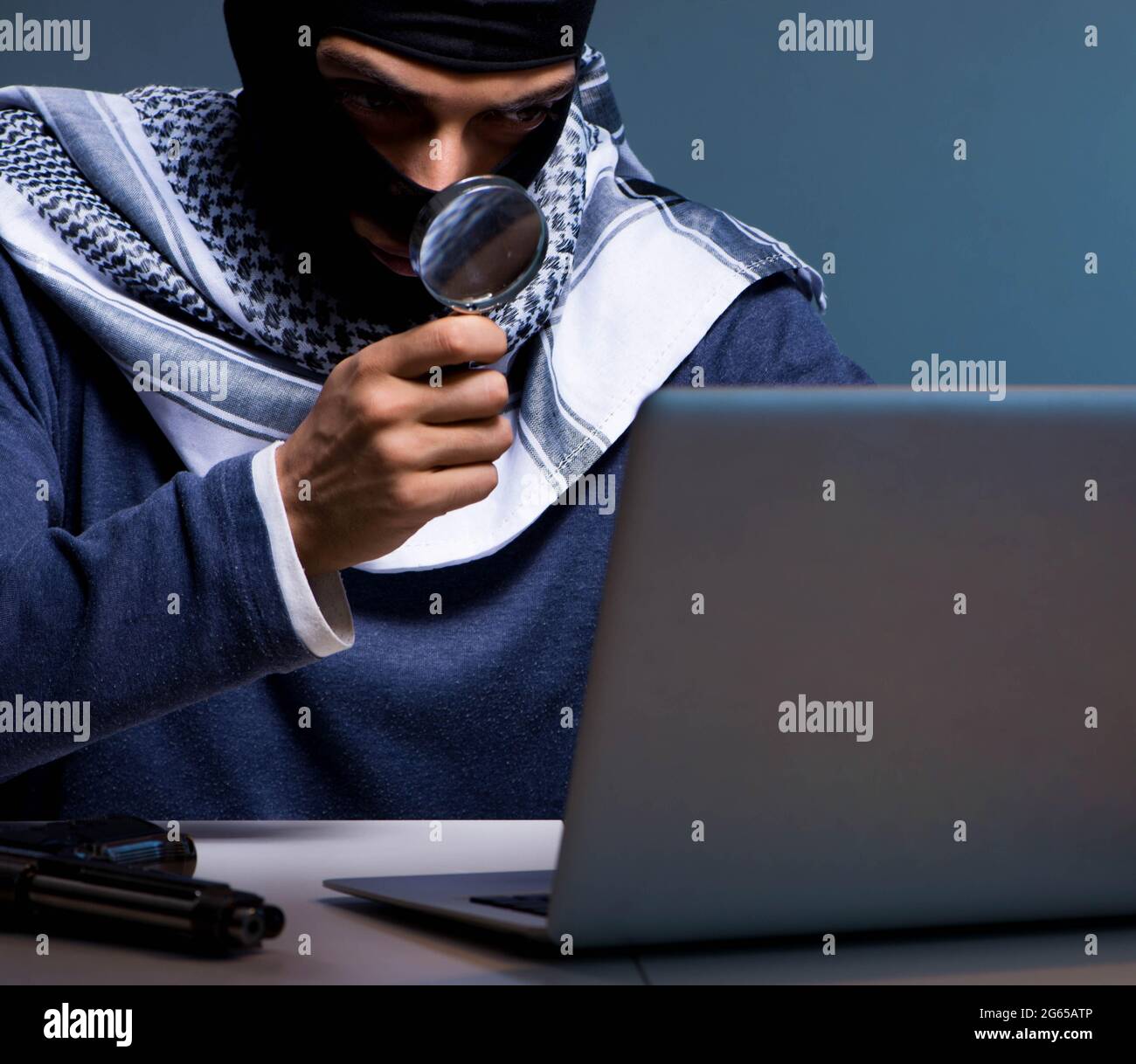 The hacker wearing balaclava mask hacking computer Stock Photo - Alamy