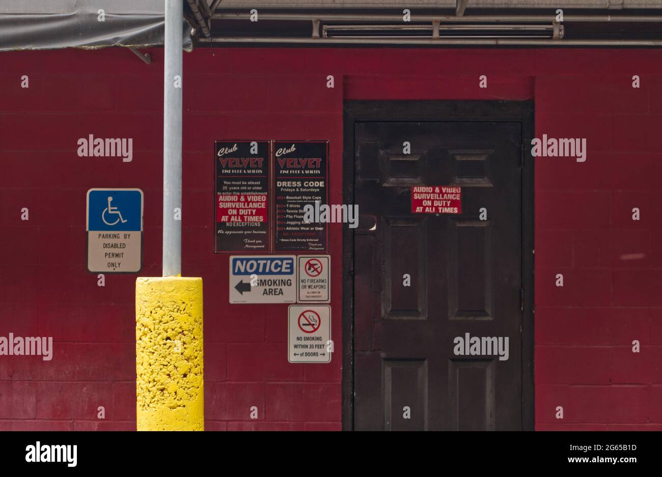 Augusta, Ga USA - 03 17 21: Many signs on a nightclub entrance door ...
