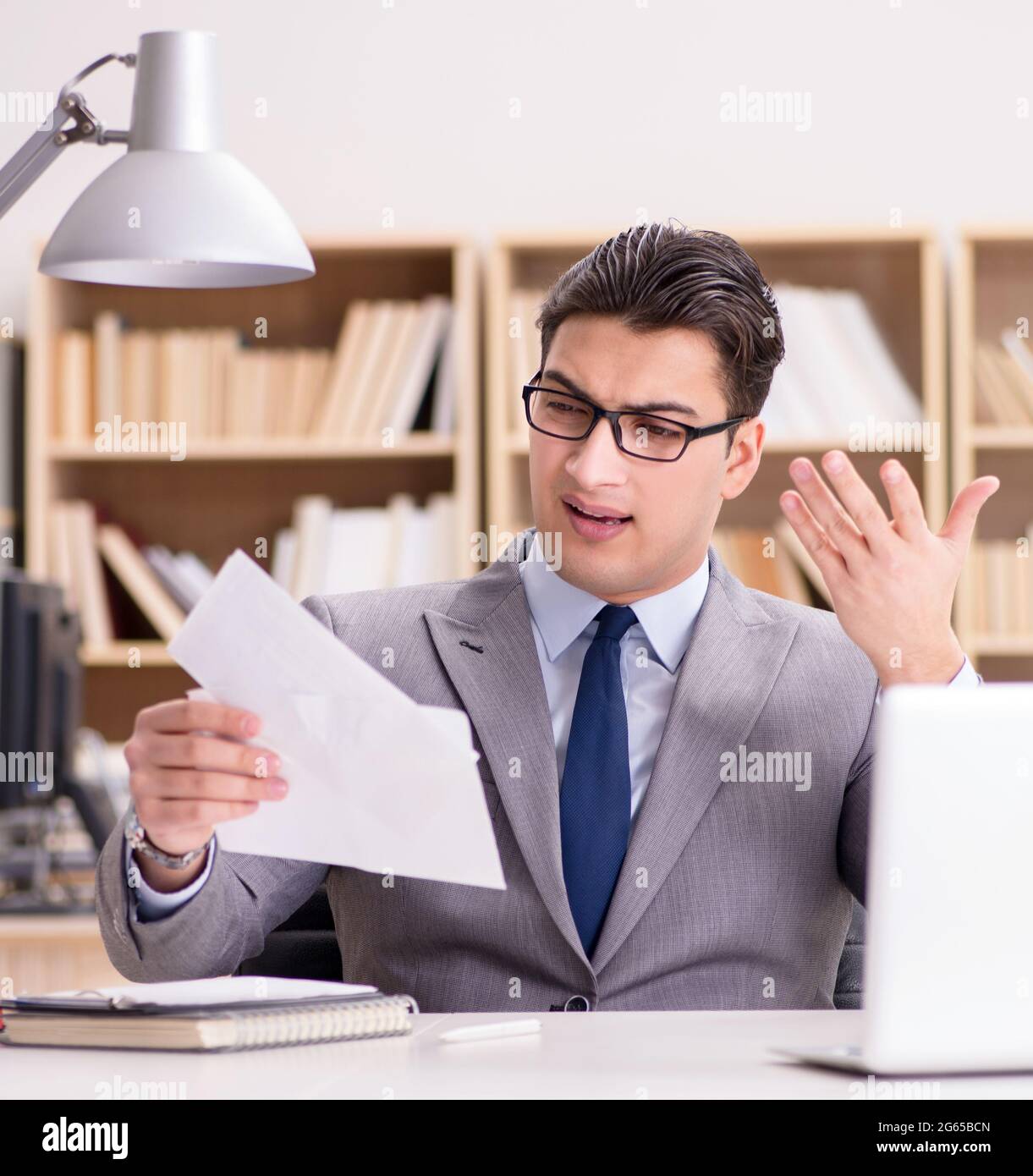 The businessman receiving letter in the office Stock Photo - Alamy
