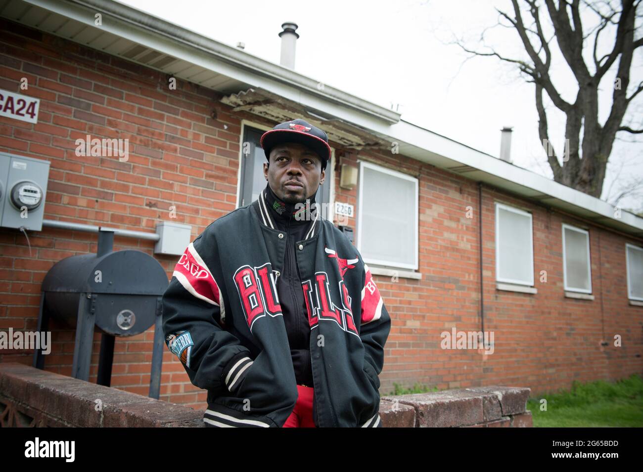 Gary, Indiana, USA. 28th Apr, 2021. Arion Knight, 44, sits outside his ...