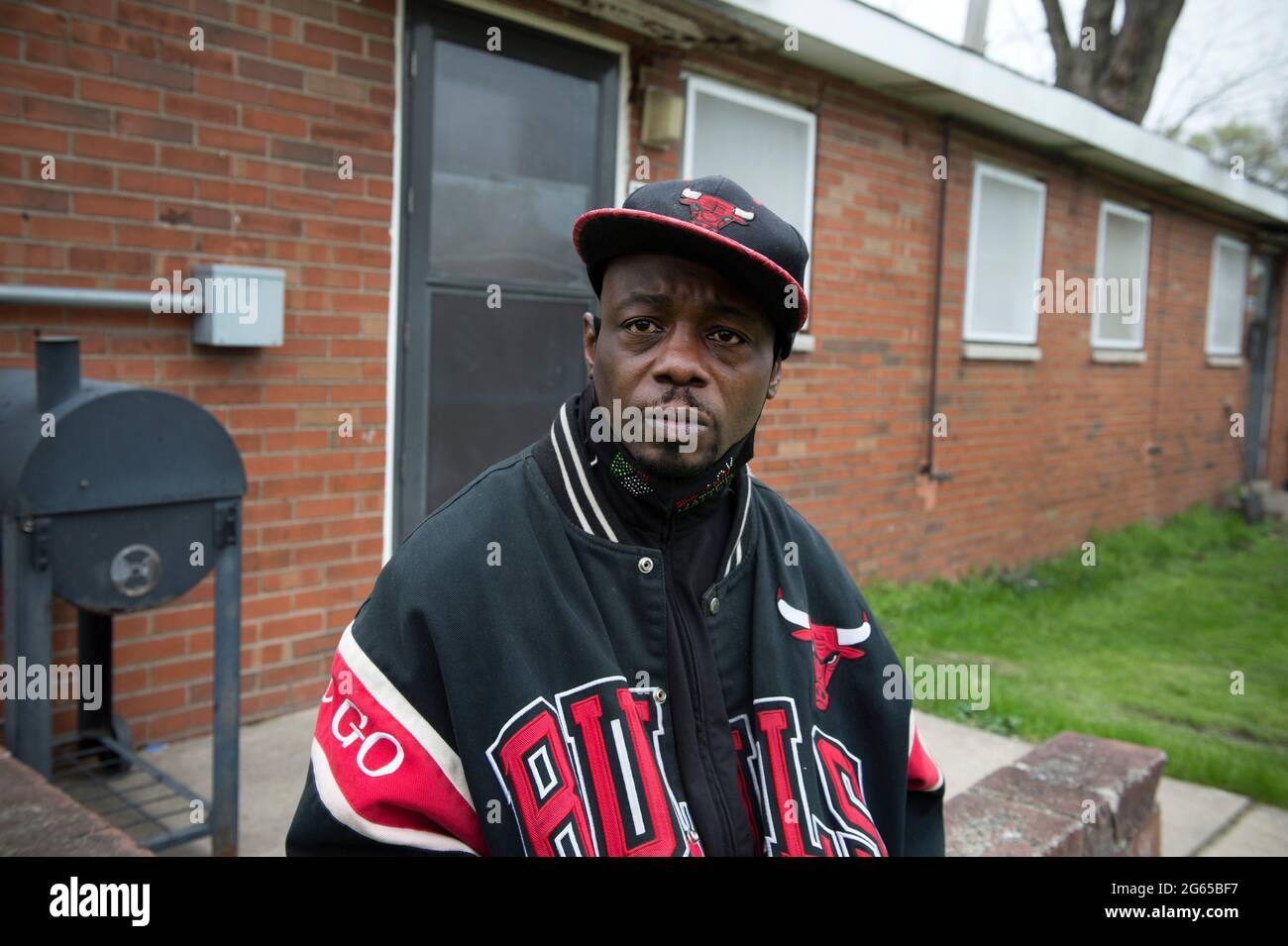 Gary, Indiana, USA. 28th Apr, 2021. Arion Knight, 44, sits outside his ...