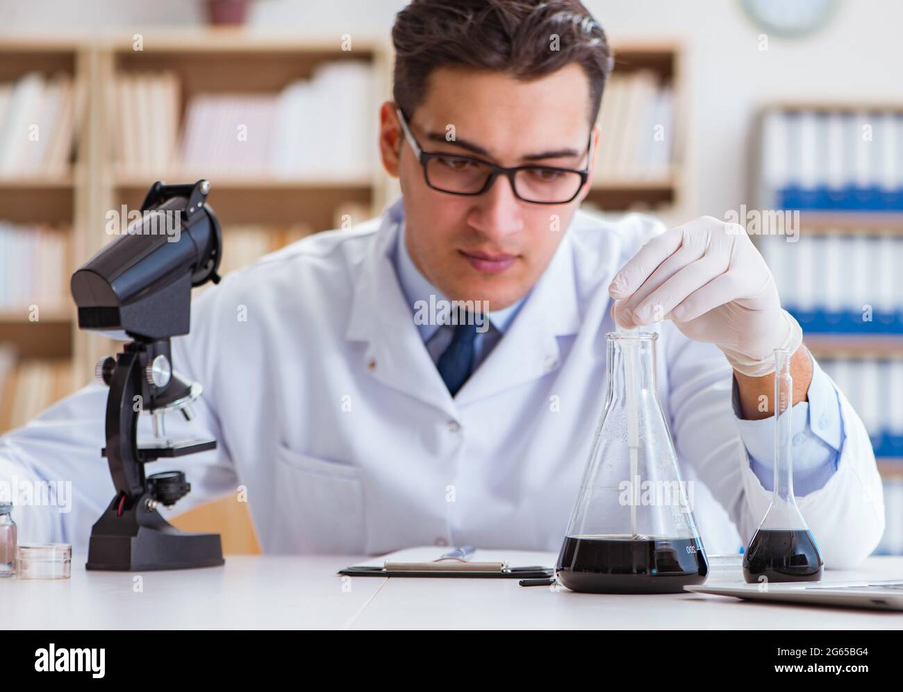 The chemical engineer working on oil samples in lab Stock Photo - Alamy