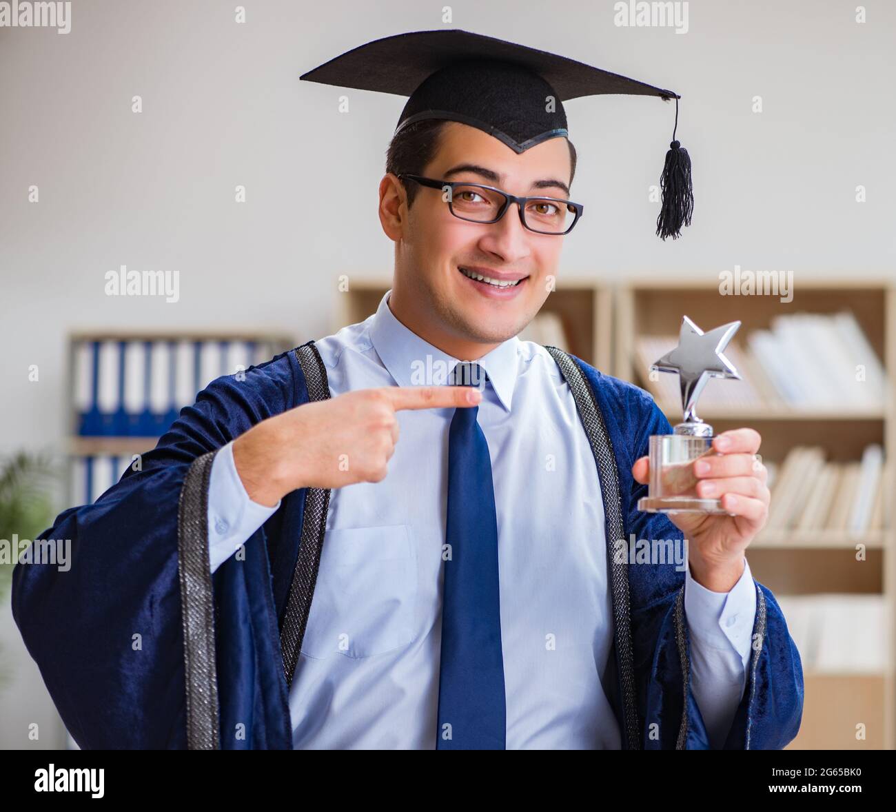 The young man graduating from university Stock Photo - Alamy