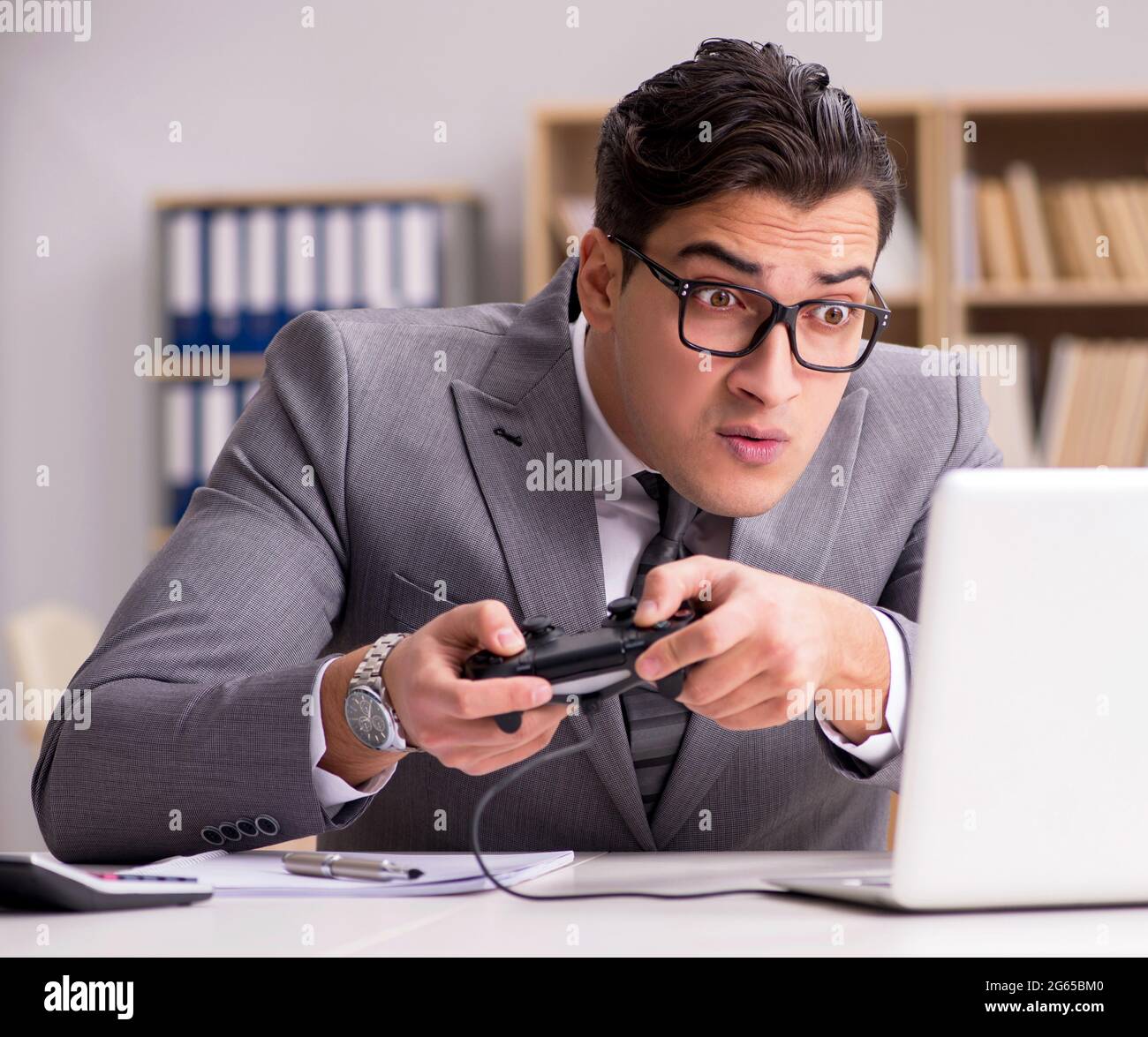 The businessman playing computer games at work office Stock Photo - Alamy