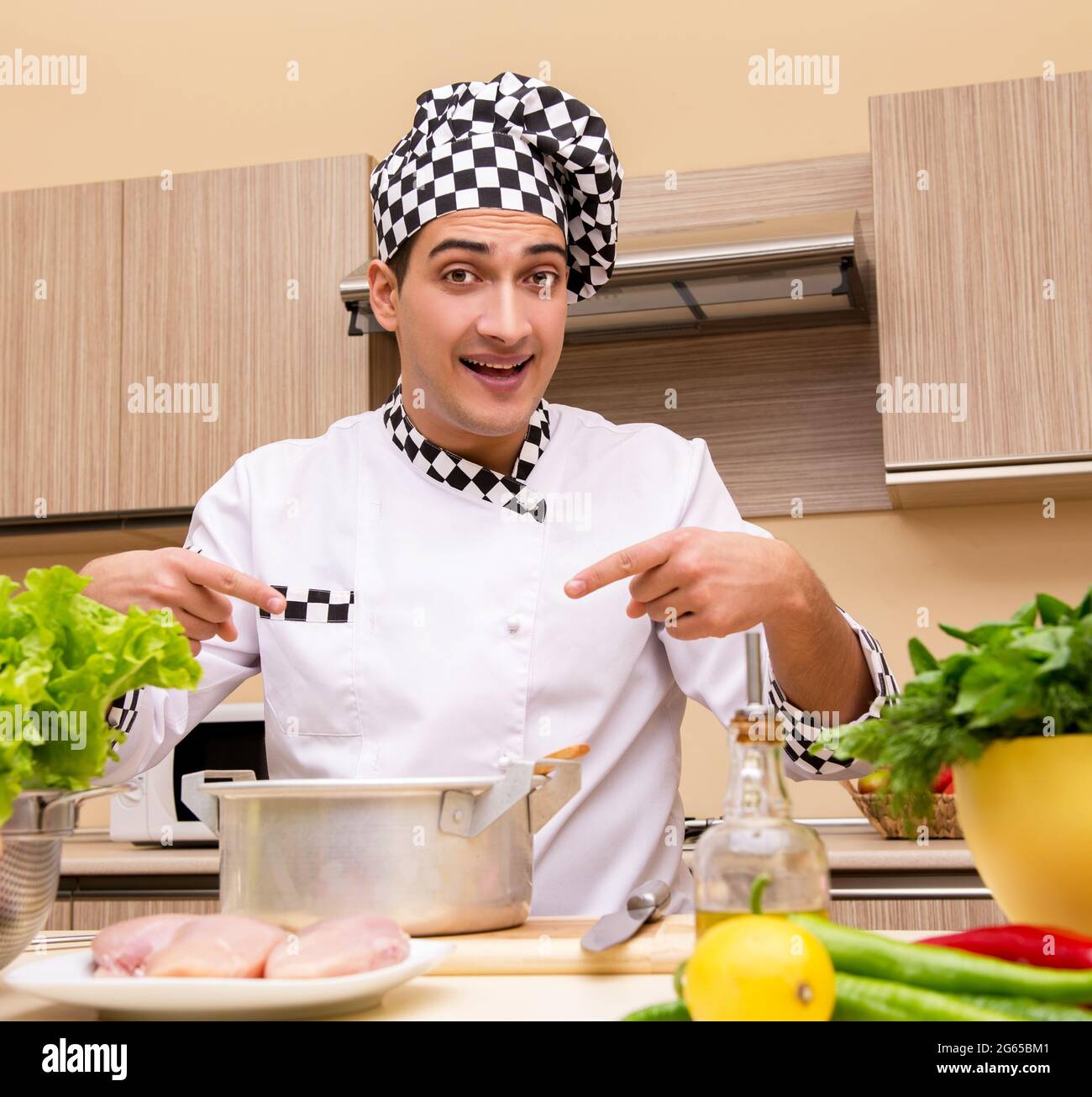 The young chef working in the kitchen Stock Photo - Alamy