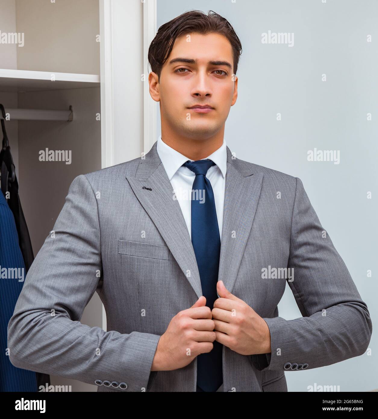 The businessman dressing up for work Stock Photo - Alamy