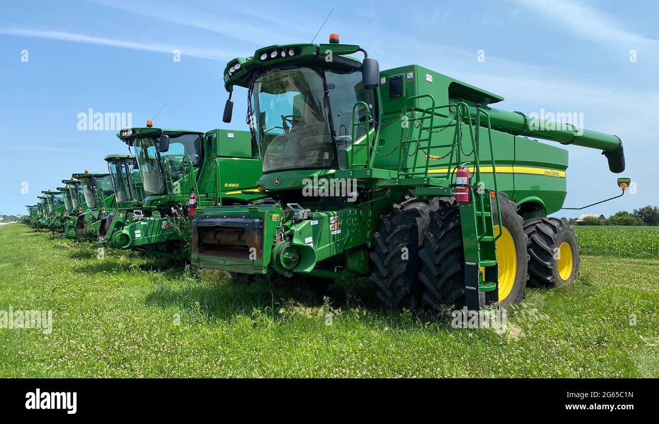 Avon, Illinois, USA. 2nd July, 2021. John Deere combine harvesters are ...
