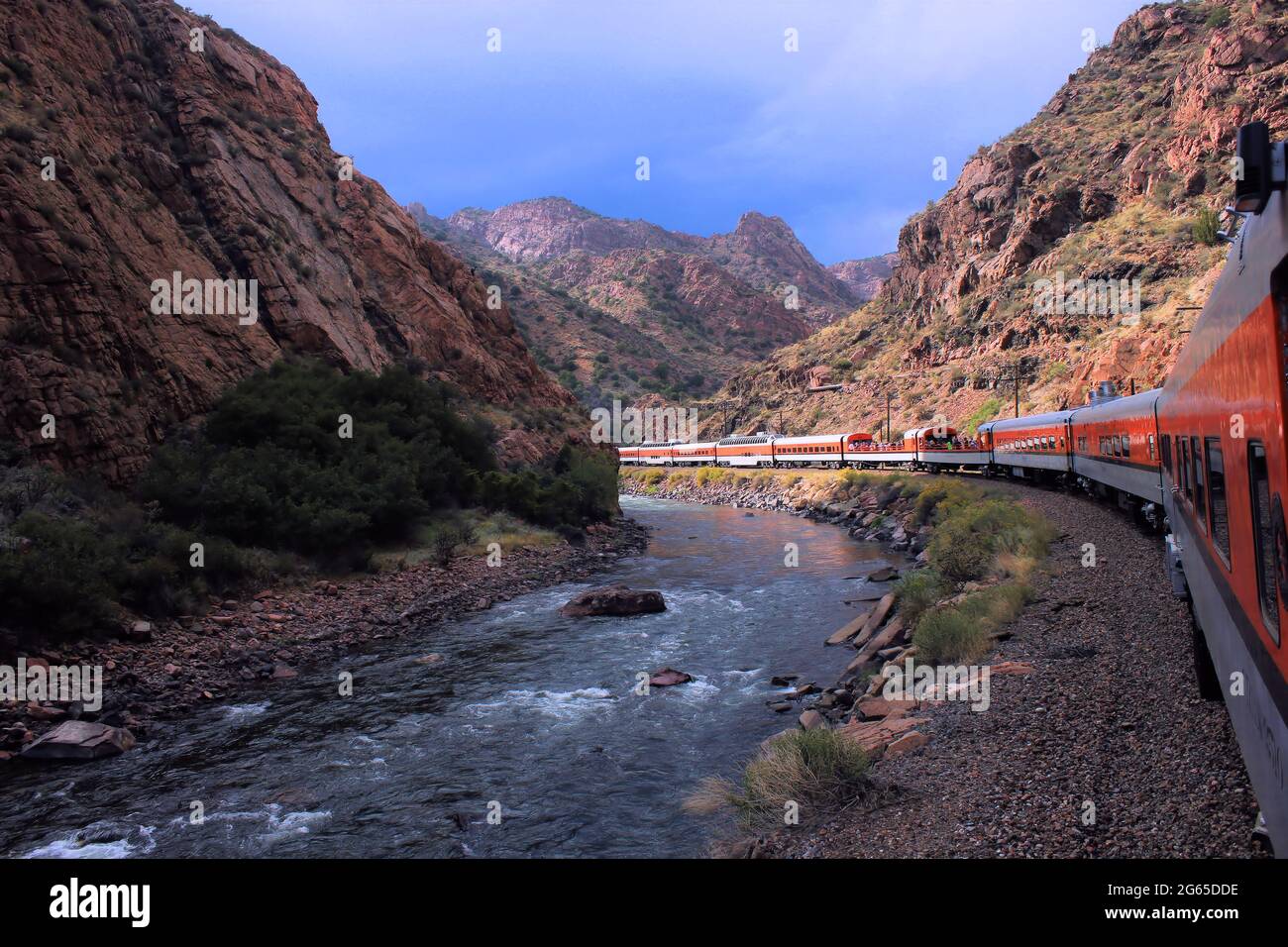 A train running along a river near the Great Gorge near Colorado ...