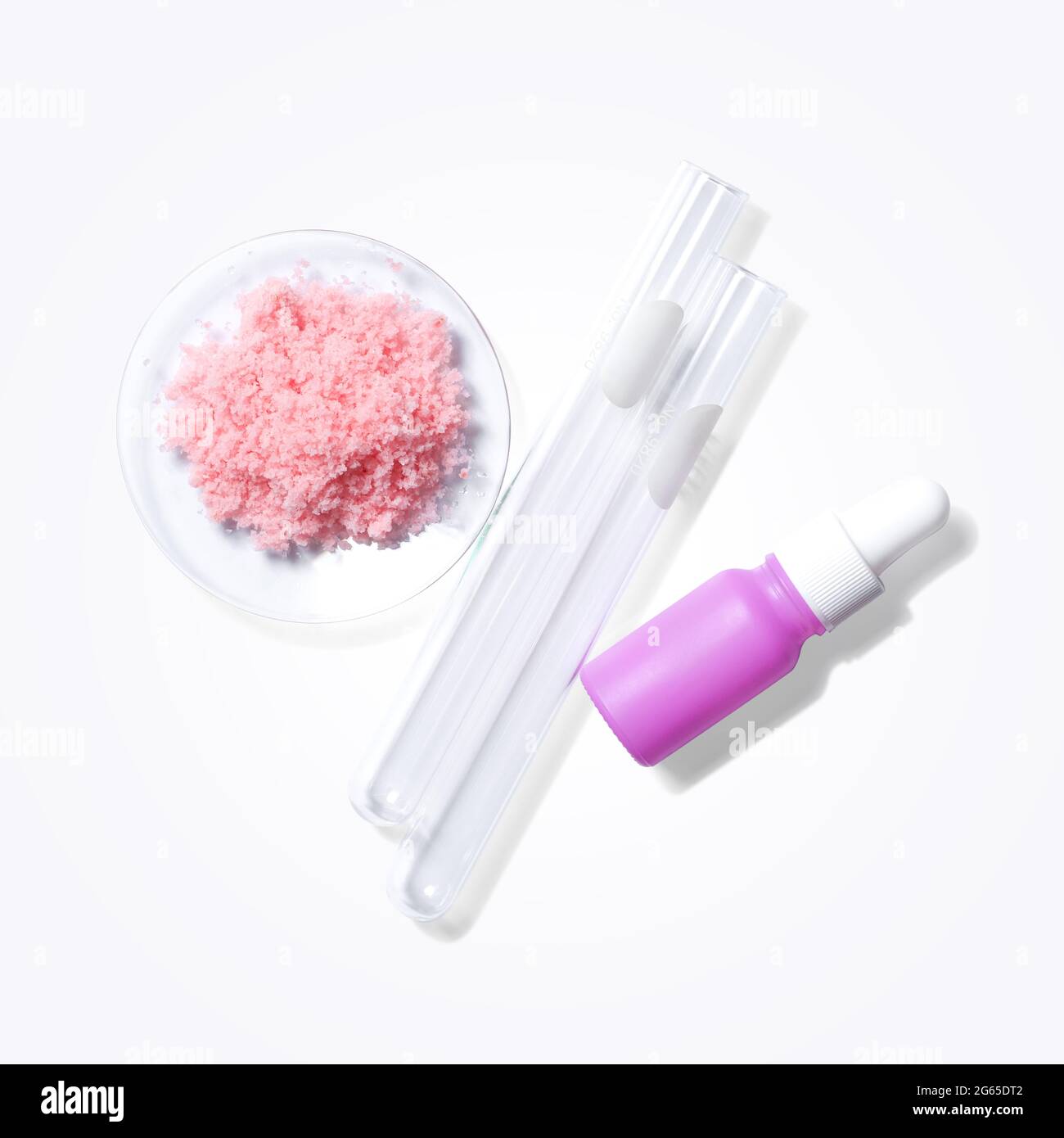 Pink flake chemicals in Chemical Watch Glass and test tube placed next ...