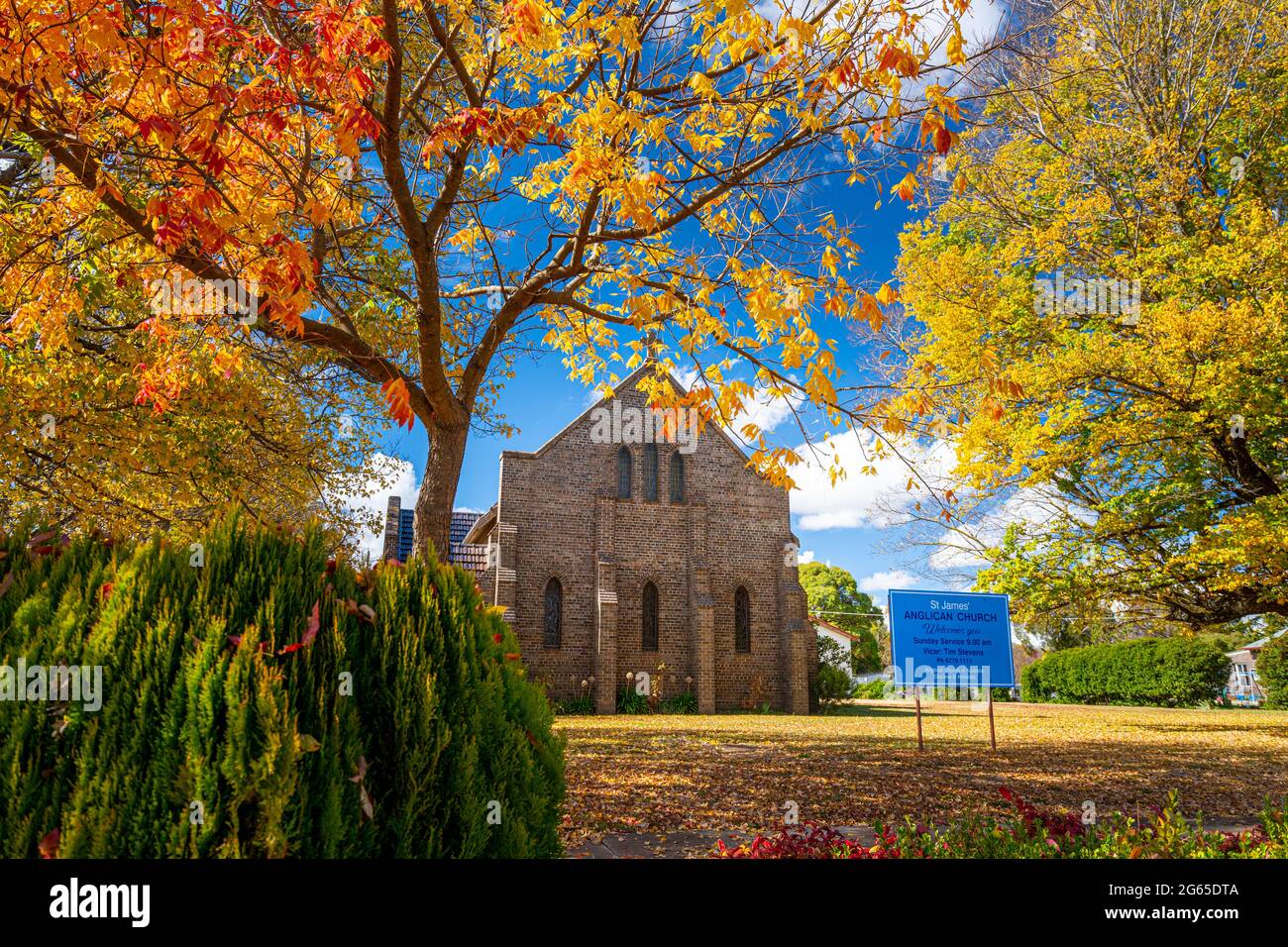 St James Anglican Church surrounded by trees with colourful autumn ...