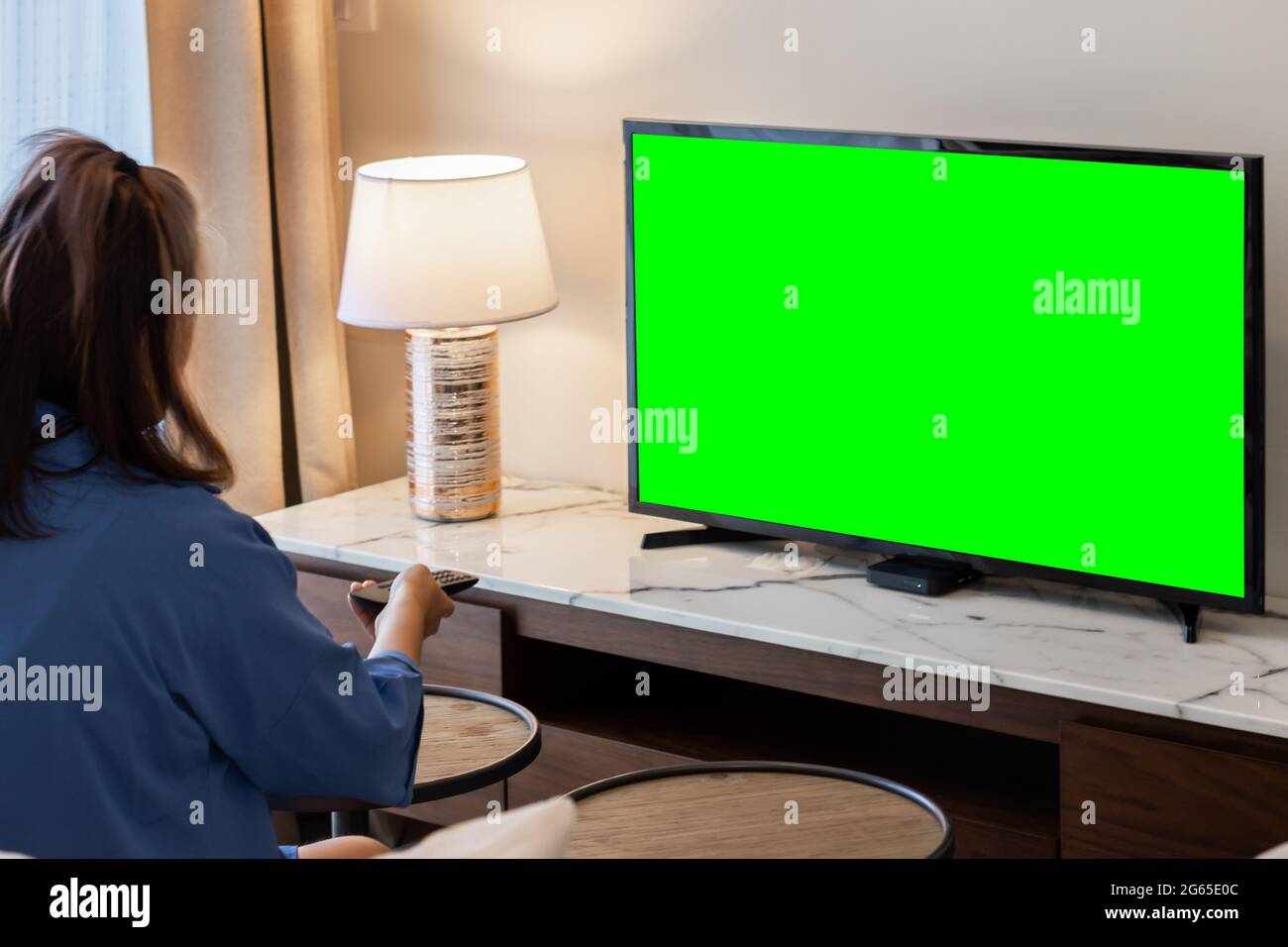 Woman watching television green screen hi-res stock photography and ...