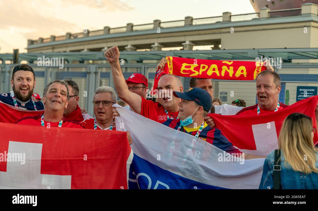 Swiss and Spanish football fans in colorful outfits, with national ...