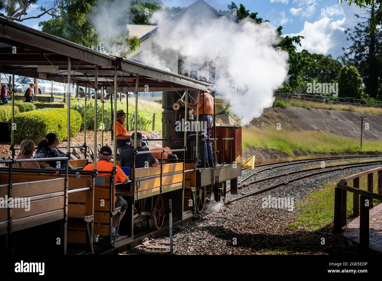 Tourists riding on the Mary Ann replica steam locomotive in Maryborough ...