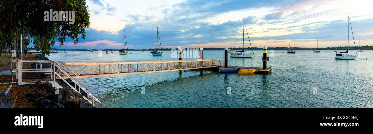 Kayaks tied to boating pontoon at dawn, Burrum River, Bururm Heads ...