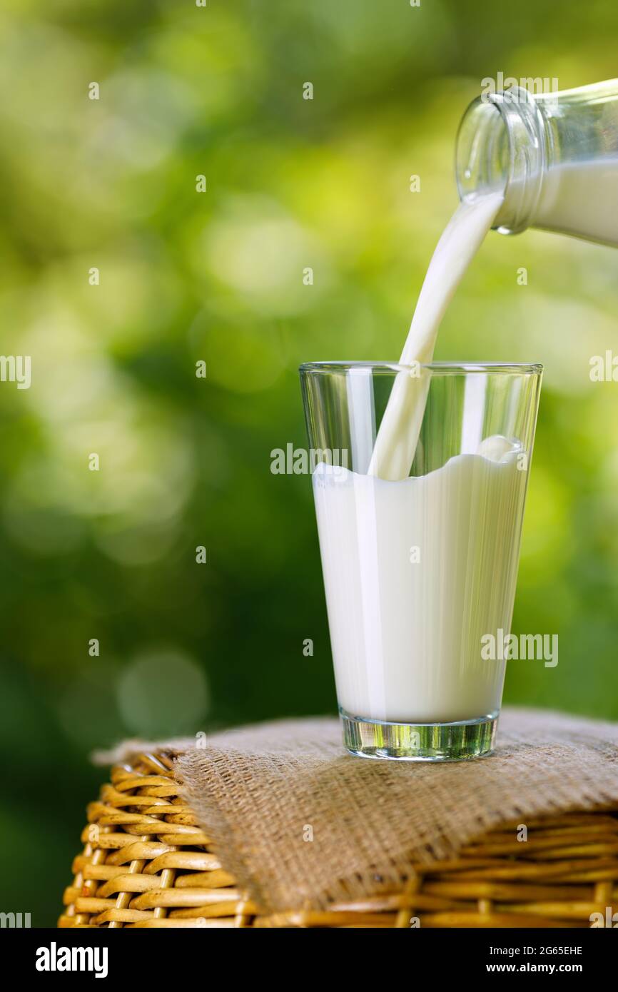 Milk from bottle pour glass hi-res stock photography and images - Alamy