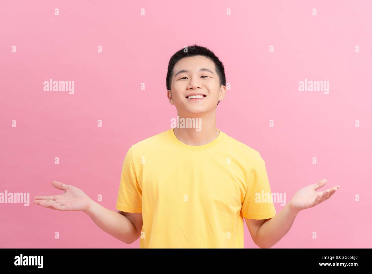 young man choosing between 2 different options, holding two hands with ... young man choosing between 2 different options, holding two hands with ...