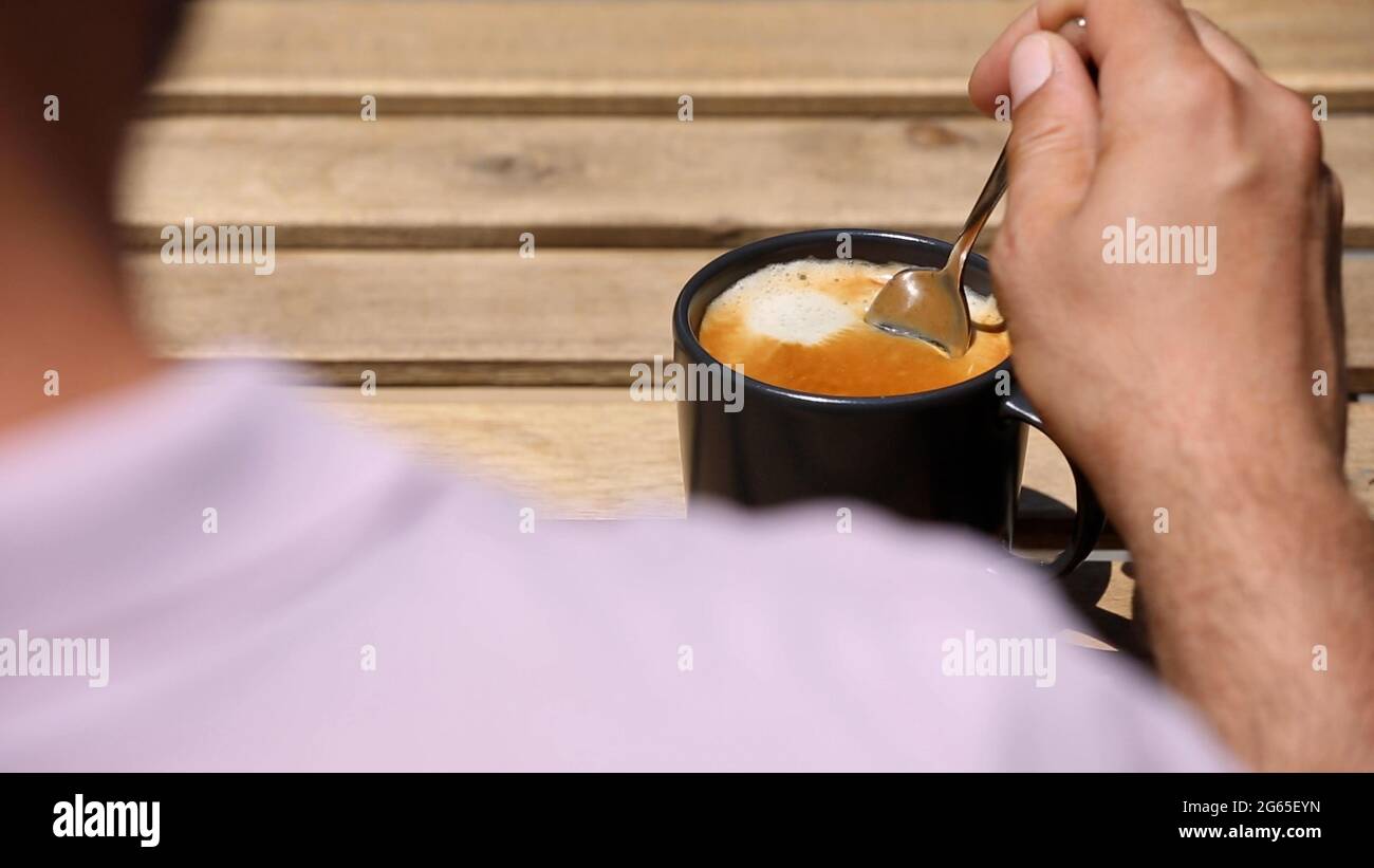 Hand stirring coffee hi-res stock photography and images - Alamy