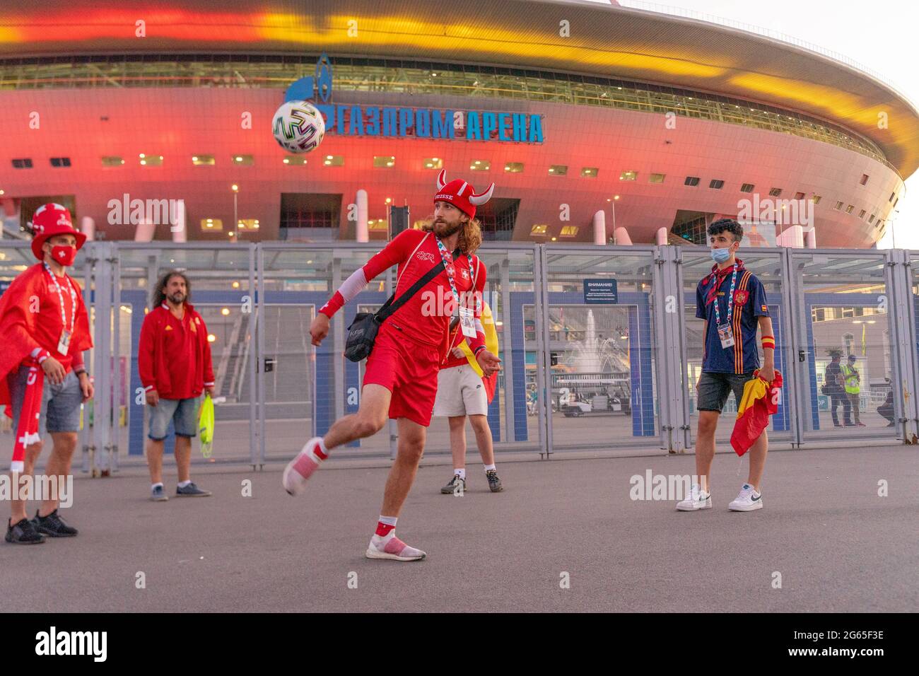 Spanish and Swiss male football fans play football after UEFA EURO 2020 ...