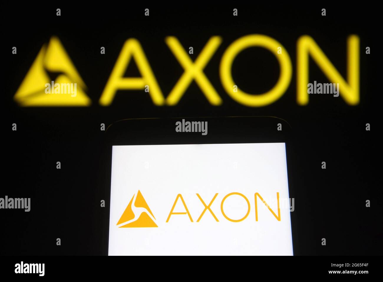 In this photo illustration an Axon Enterprise logo is seen on a ...