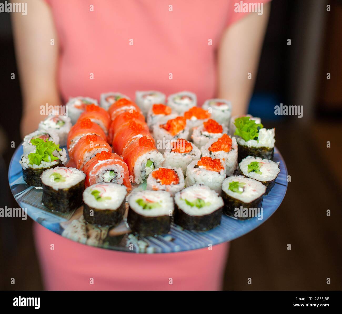 Making sushi and rolls at home. Sushi with seafood, salad and white ...