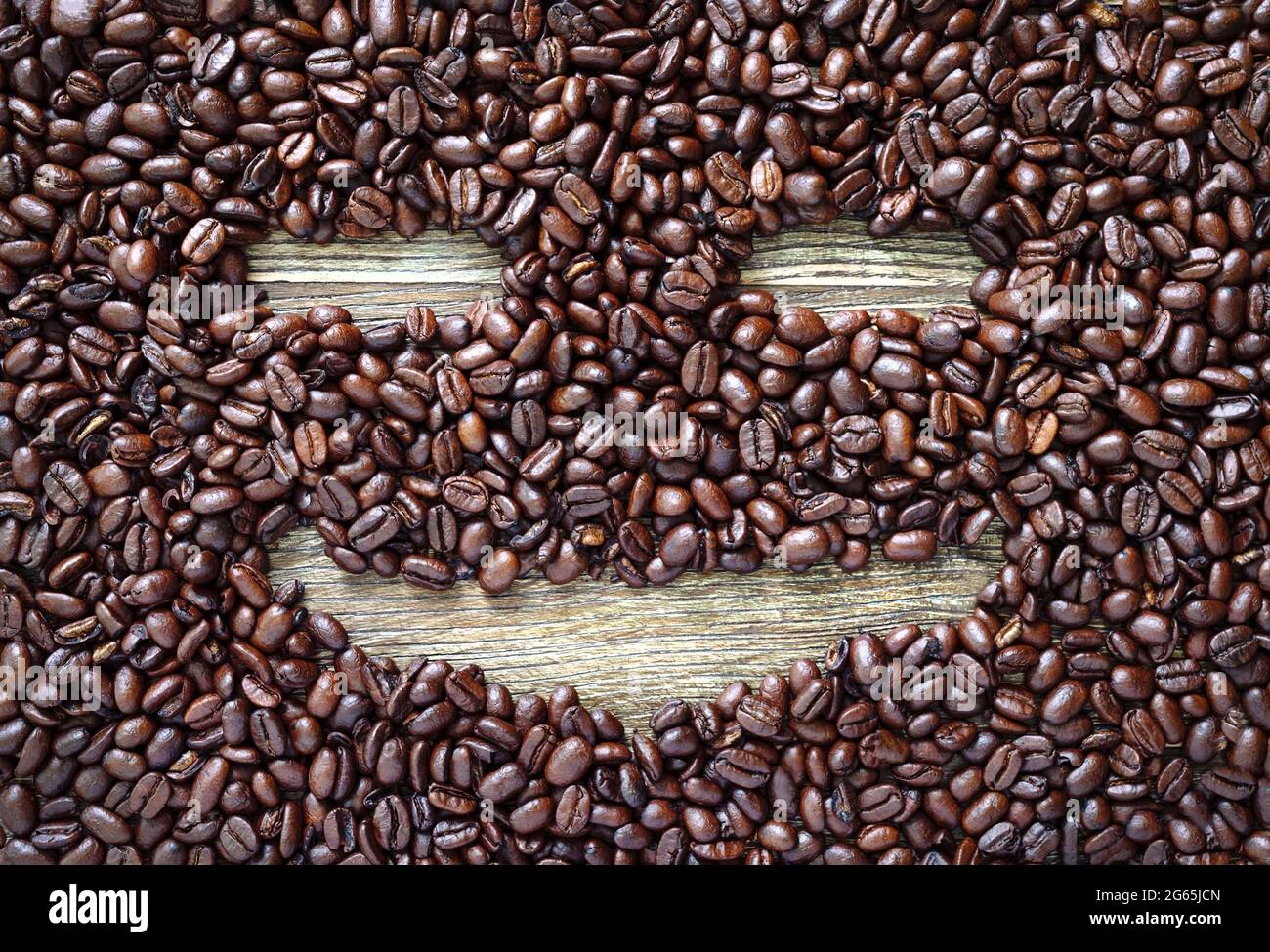 Funny face made from coffee beans. Creative vision of the coffee theme ...