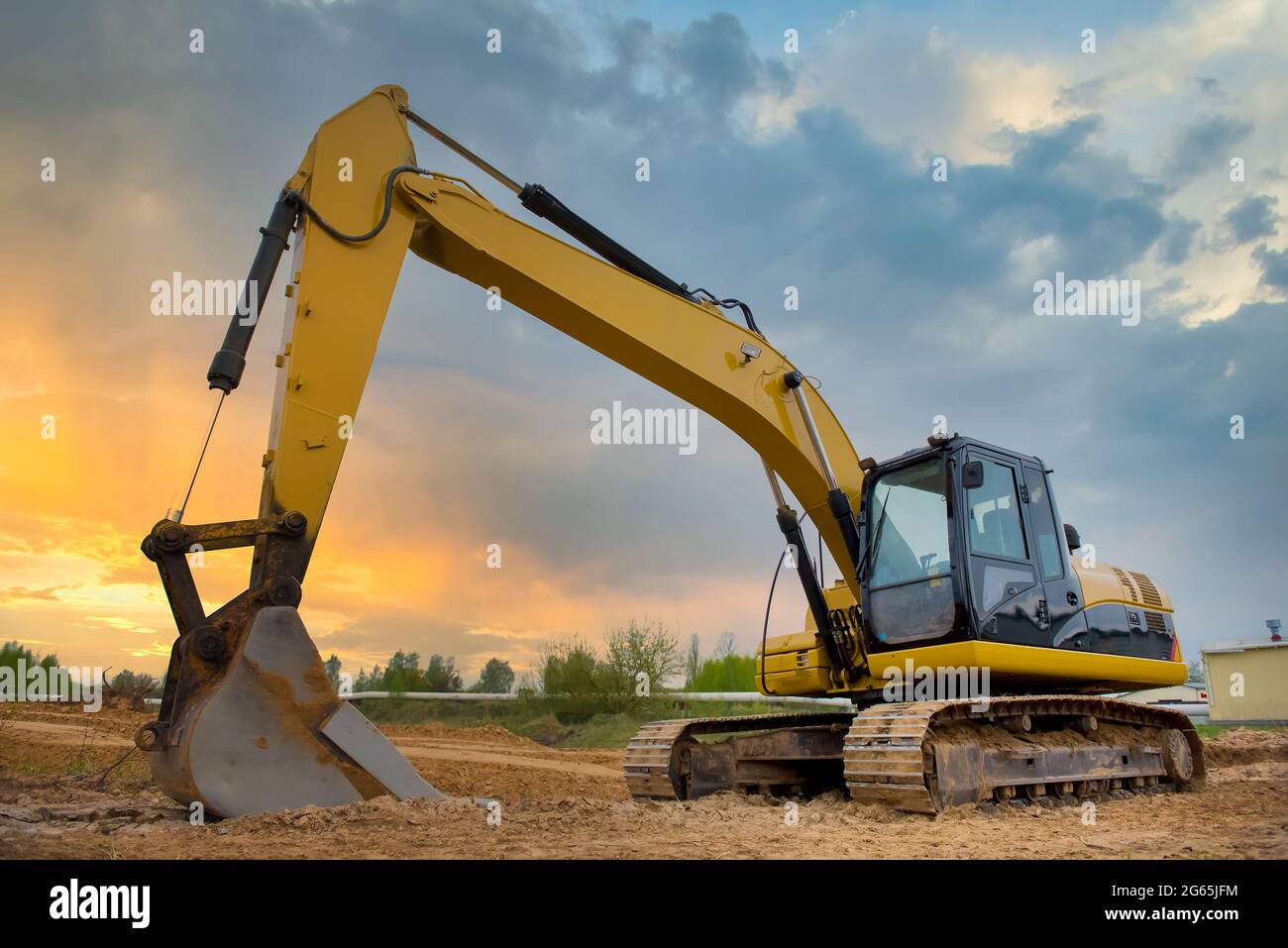 Excavator. A machine for earthworks. Construction site. Excavator for ...