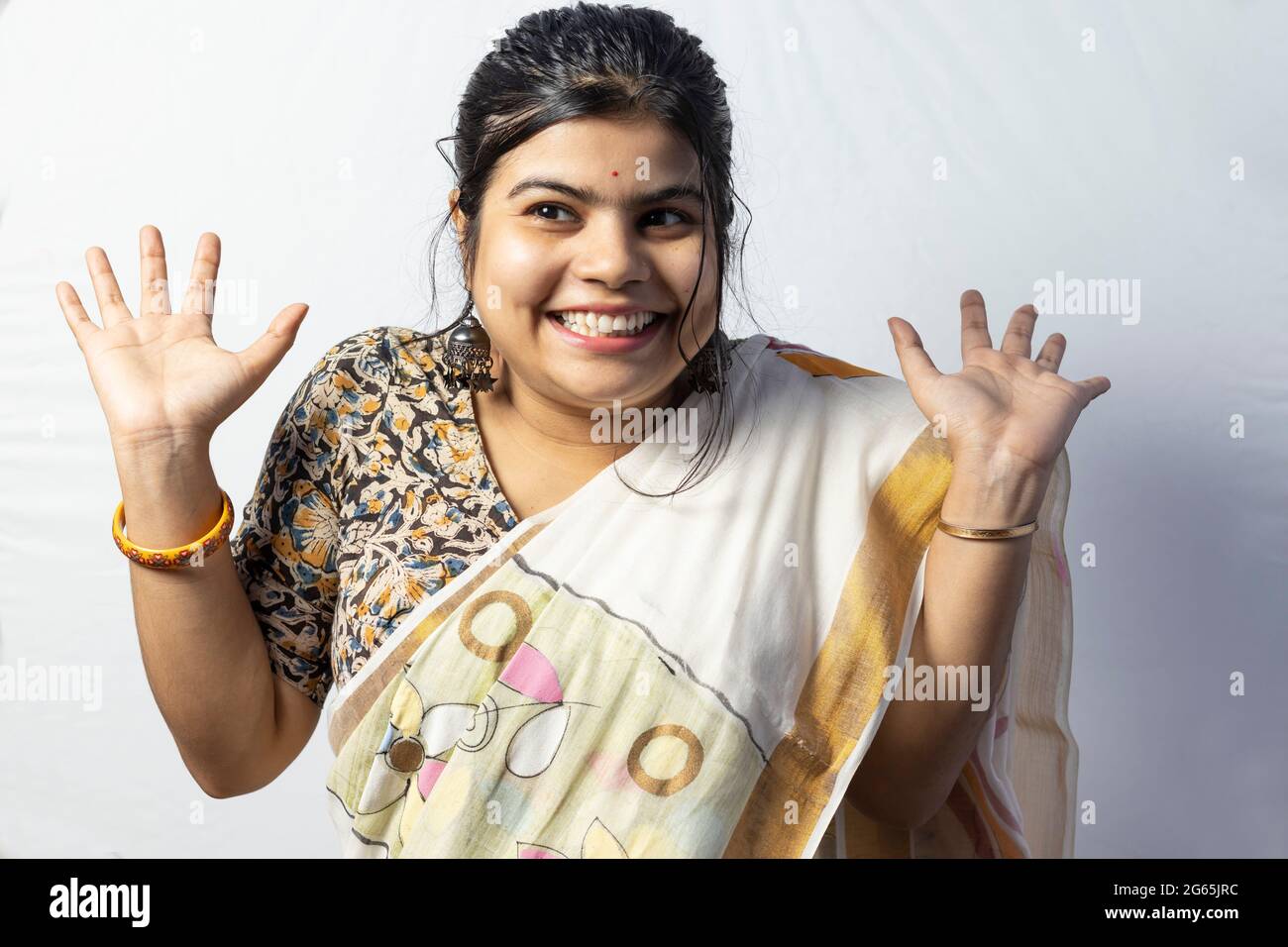 Isolated on white background an Indian woman in saree smiling in ...