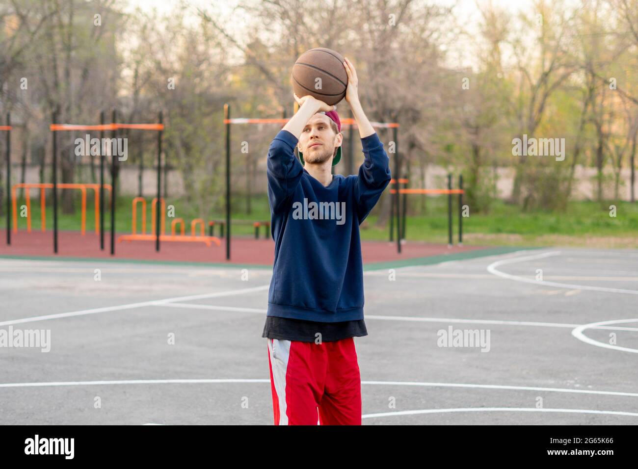 basketball player doing practice shooting drills outdoor in the city ...