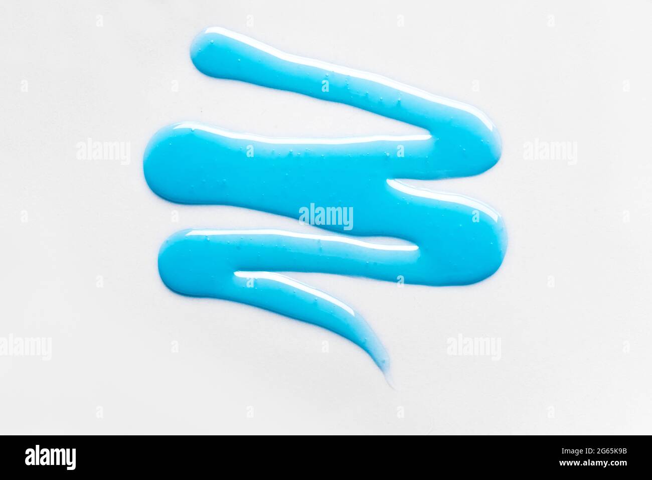 Blue shampoo or shower gel sample drop on white background. Blue gel ...