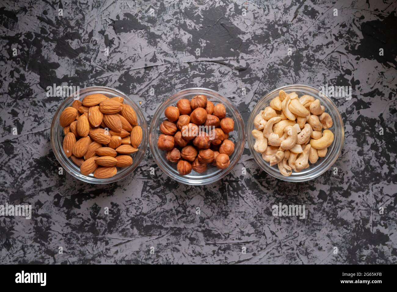 Assorted Raw Nuts In A Bowl Top View, Cashew Nuts, Almonds, Hazelnuts