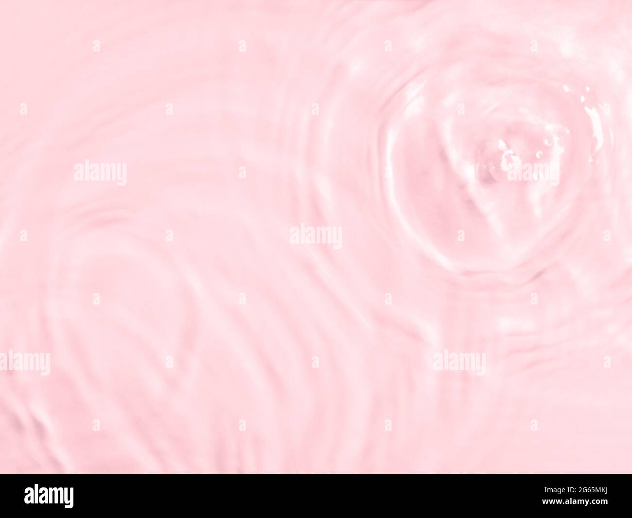 Pink water surface color background with ripples, circles and drops ...