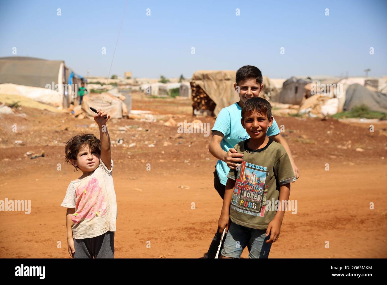 July 2, 2021: Idlib, Syria. 02 July 2021. Children play with kites in ...