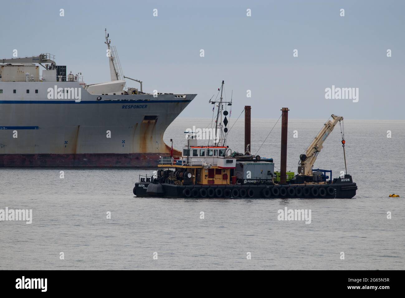Close up view of ship's bow and a support vessel in the sea off Bude ...