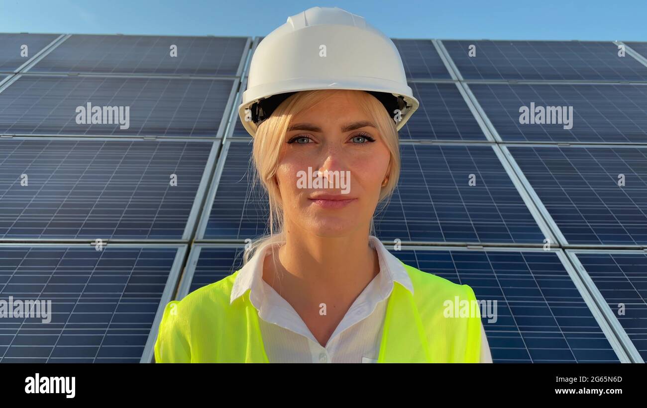 Female ecological engineer with a roll of paper where there are ...