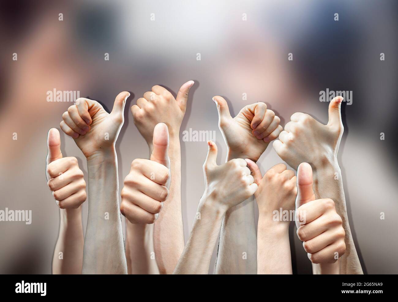 group of people raise their thumbs up Stock Photo - Alamy