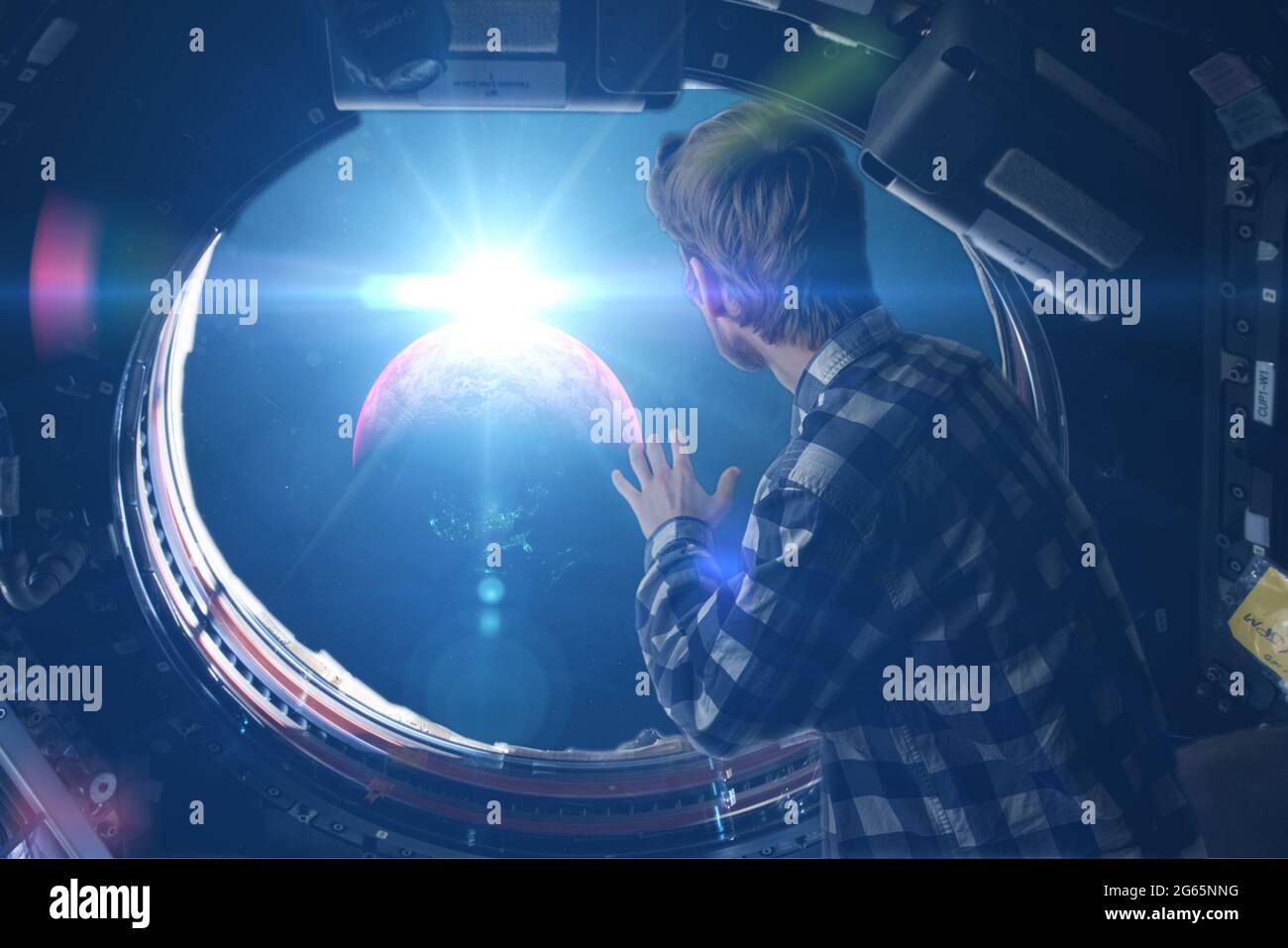 young space tourist in front of the space shuttles window. elements of ...