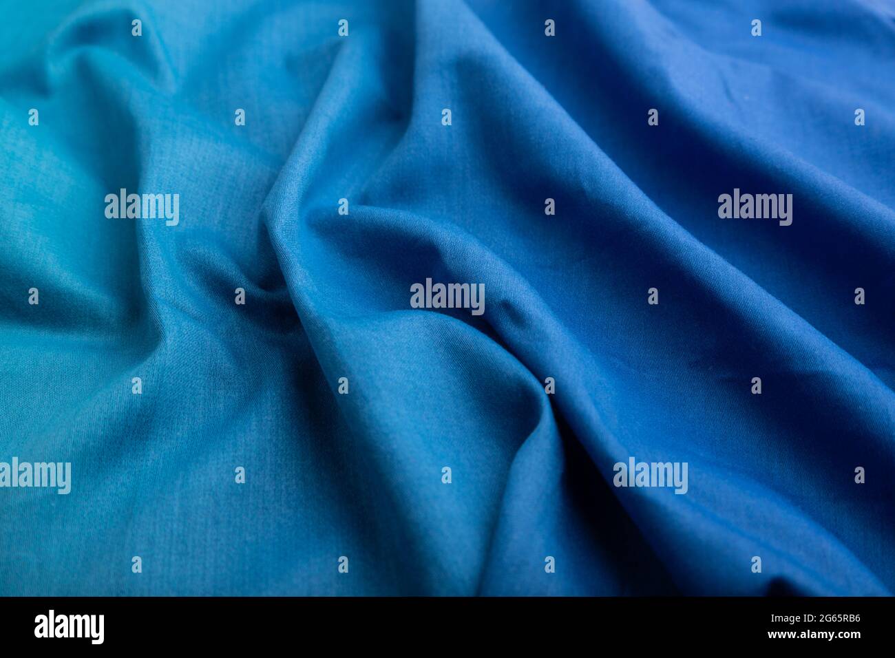 Fragment of cotton blue tissue. Side view, natural textile background ...