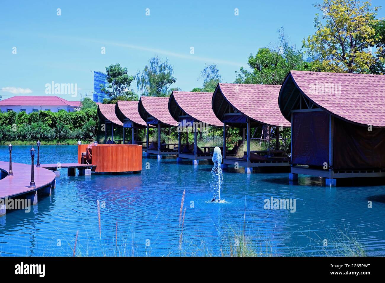 Over water pavilions and a fountain in a pond Stock Photo - Alamy