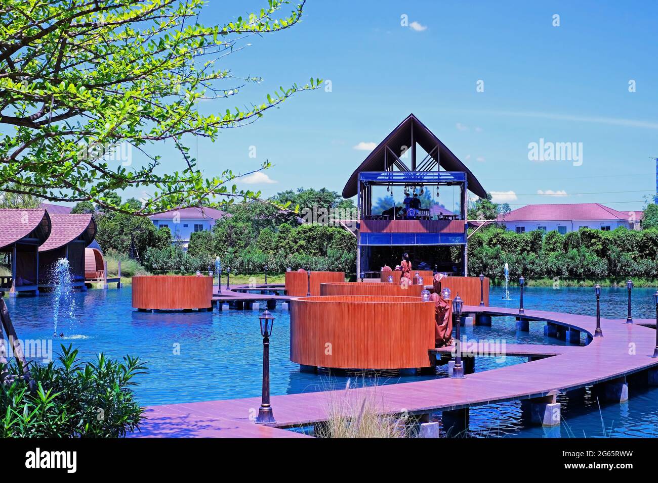 Water villas over a big pond and a wood path walk over water Stock ...