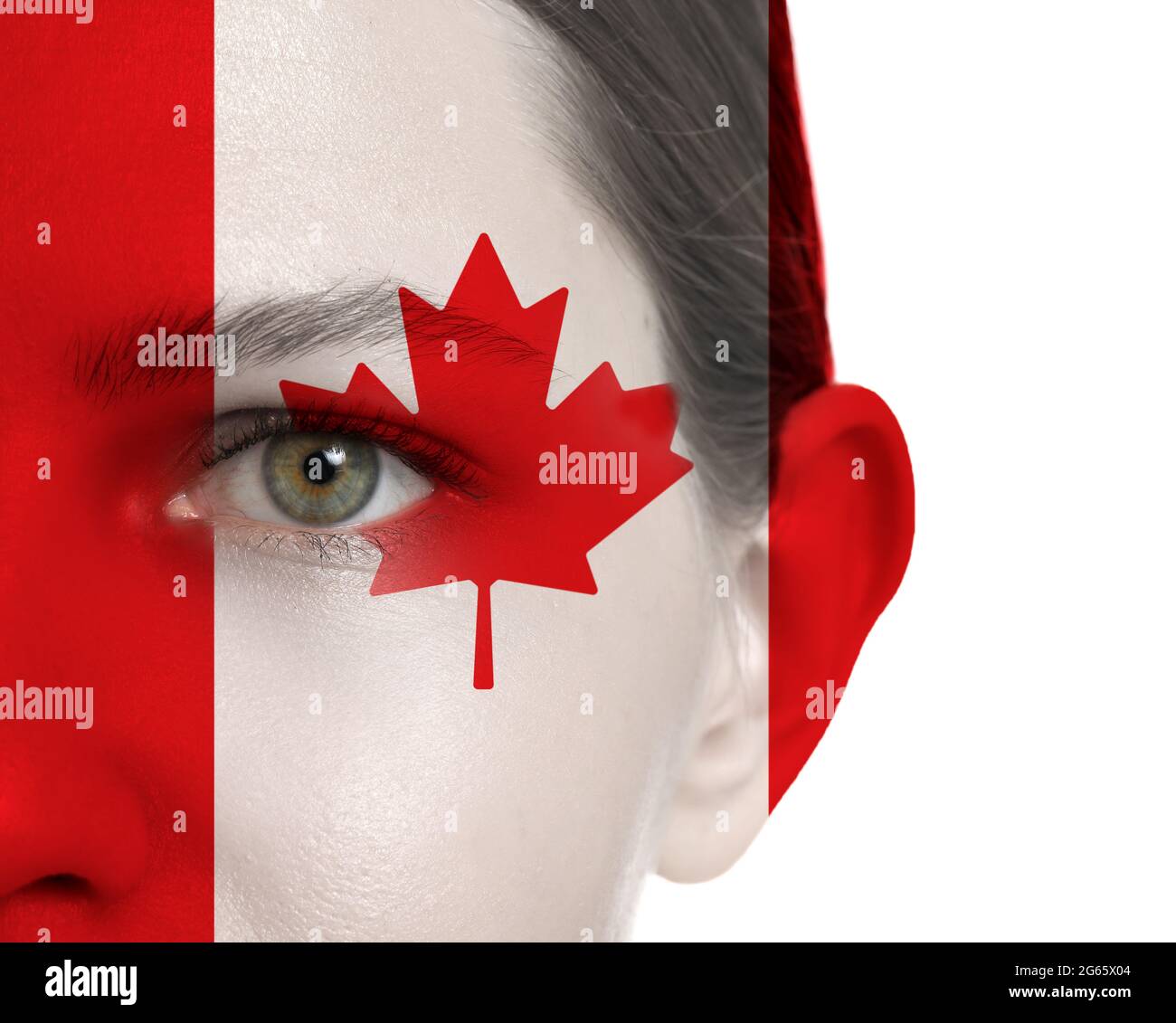 Young woman with face in colors of Canadian flag on white background ...