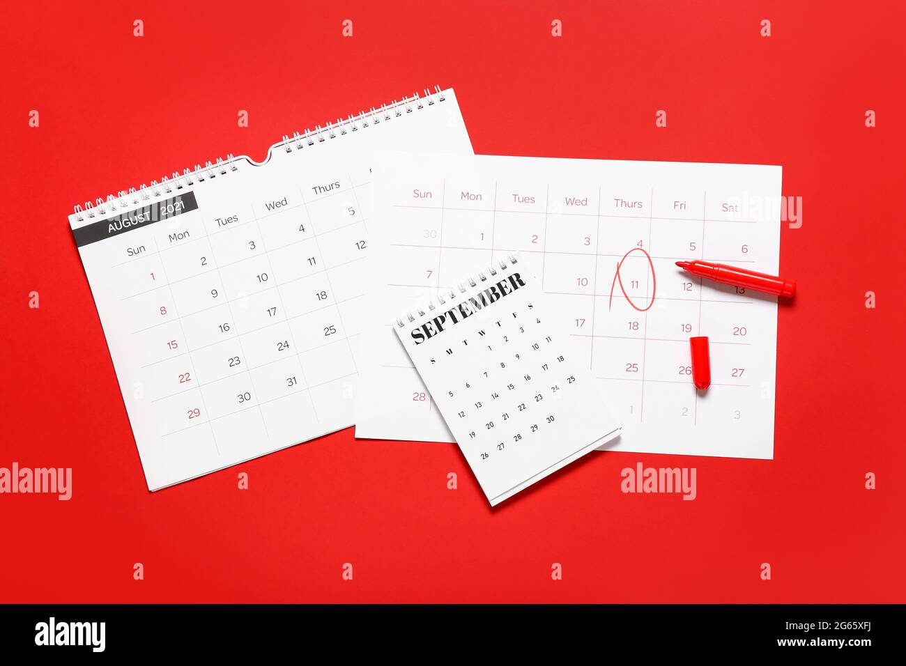Calendars with marked date and marker on color background Stock Photo ...