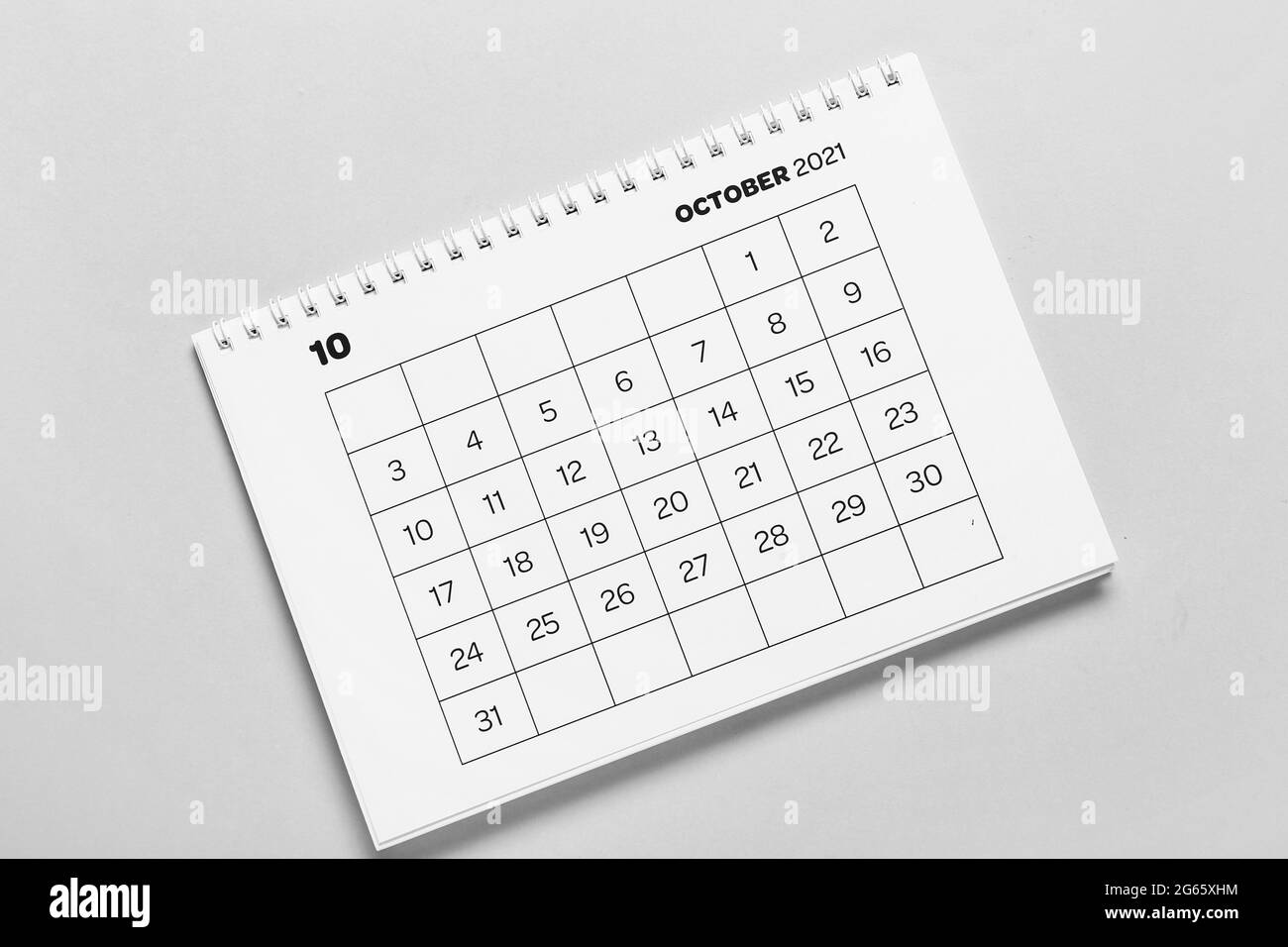 Flip paper calendar on light background Stock Photo - Alamy