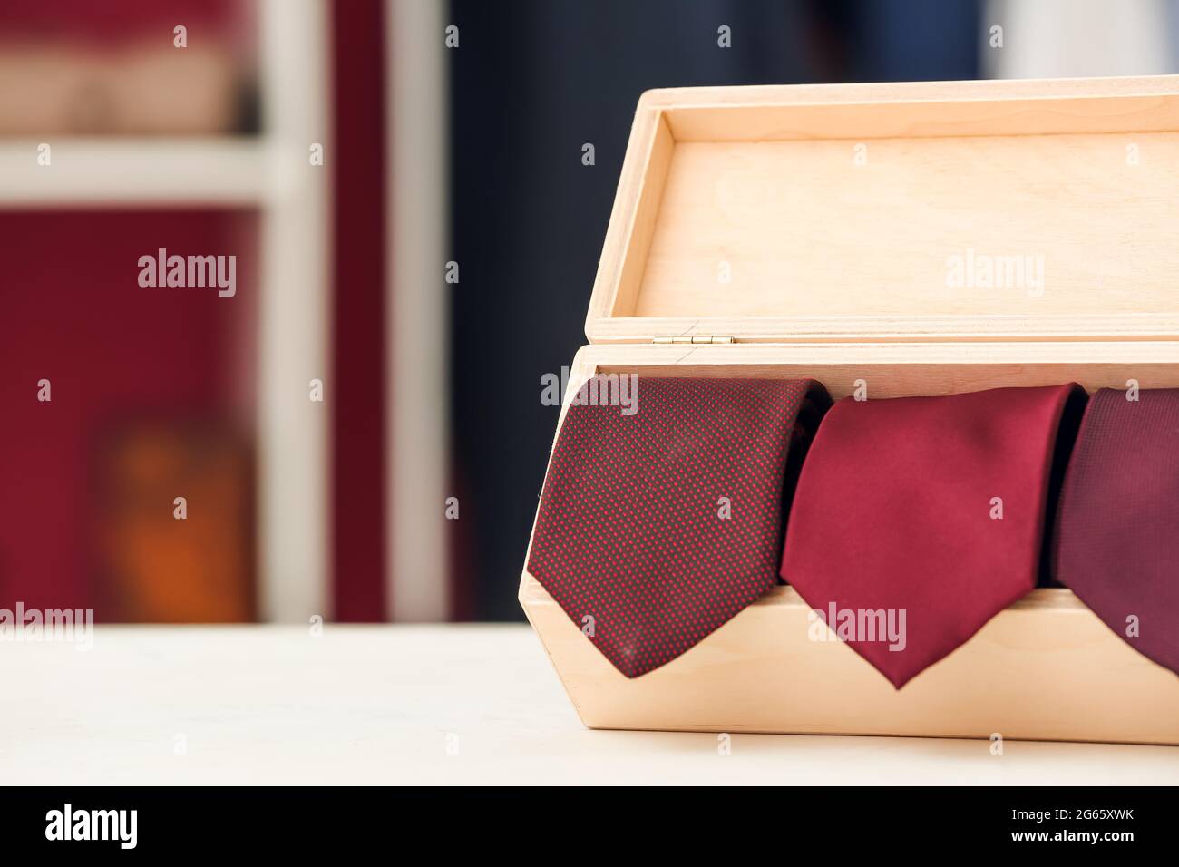 Box with stylish neckties on table, closeup Stock Photo - Alamy