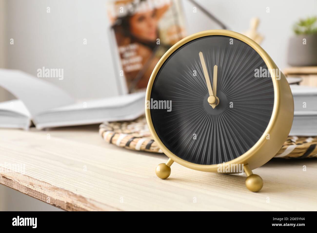 Stylish alarm clock on table, closeup Stock Photo - Alamy