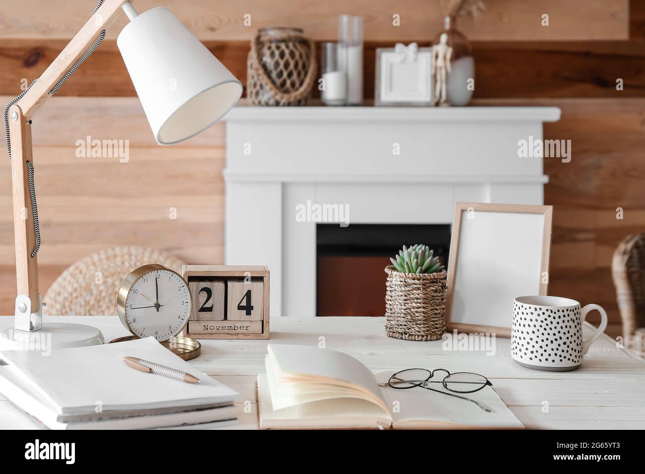 Modern workplace with alarm clock in interior of stylish room Stock ...