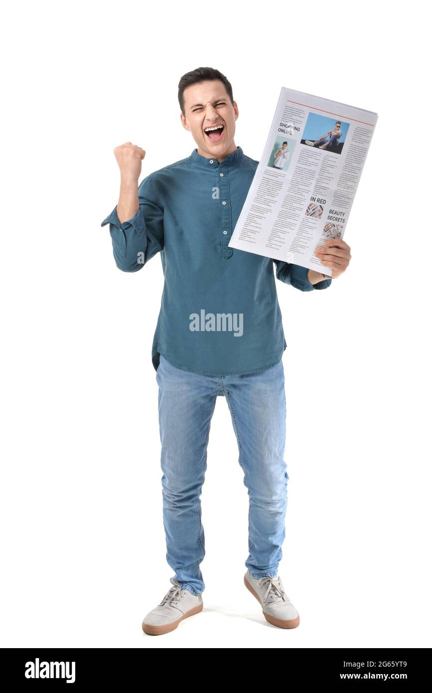 Happy young man with newspaper on white background Stock Photo - Alamy
