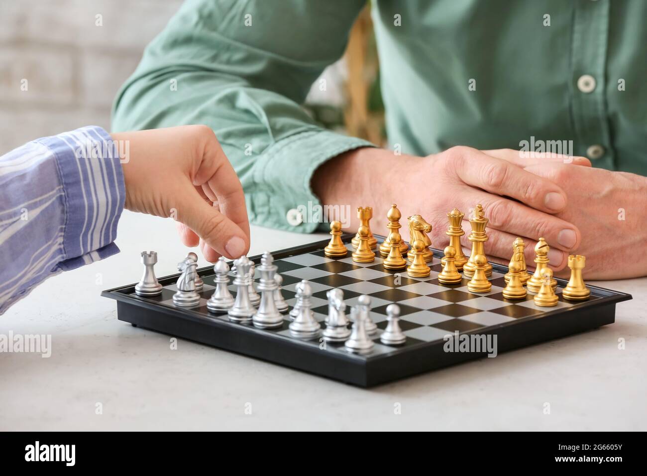 Smart boy playing chess hi-res stock photography and images - Alamy