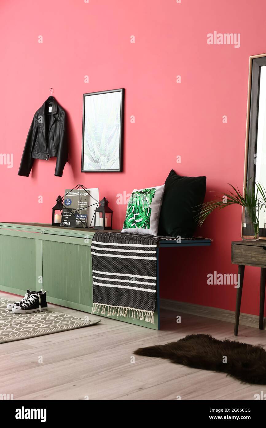 Interior of stylish hallway with folding screen Stock Photo - Alamy