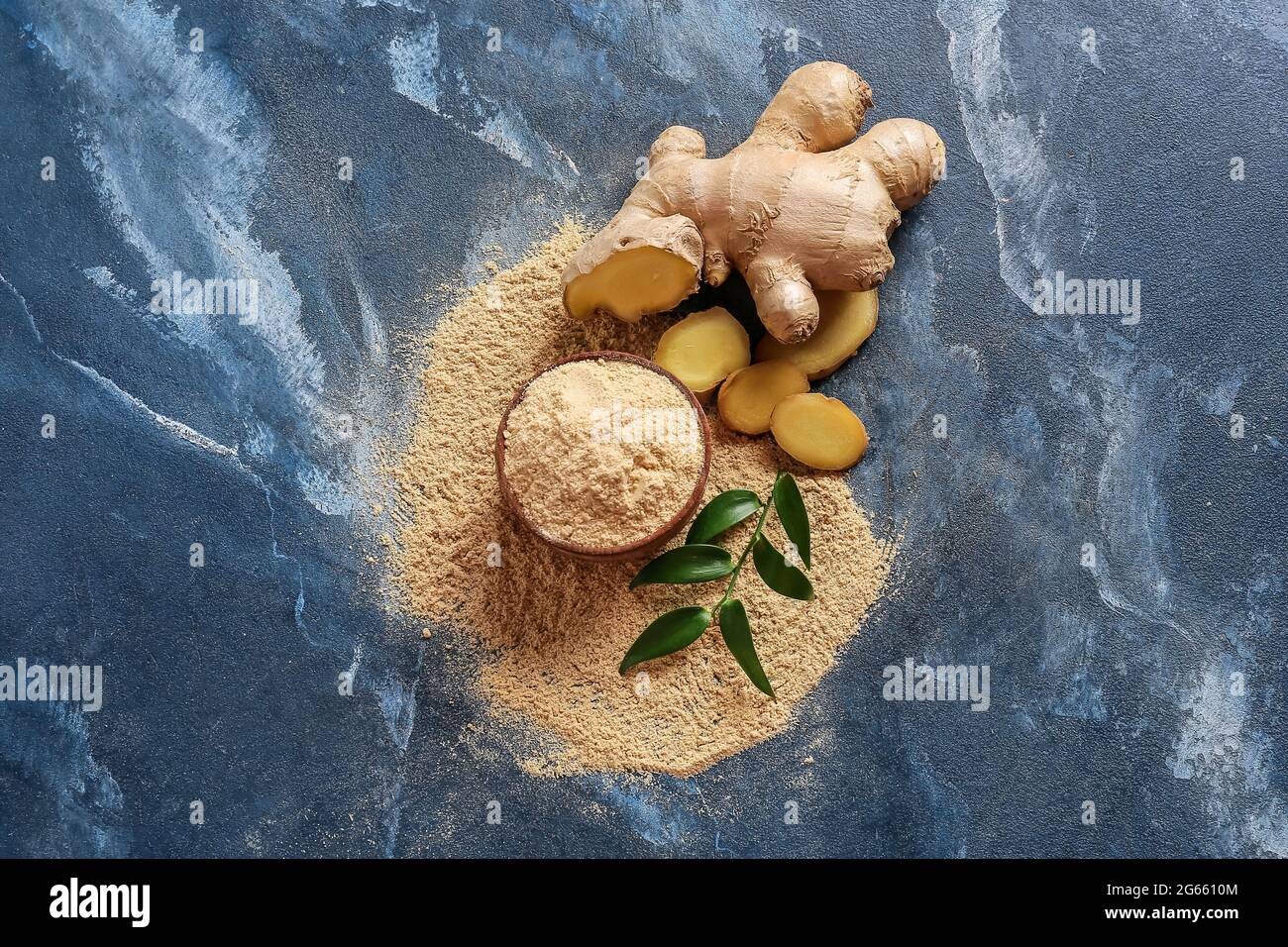Fresh and ground ginger on color background Stock Photo - Alamy