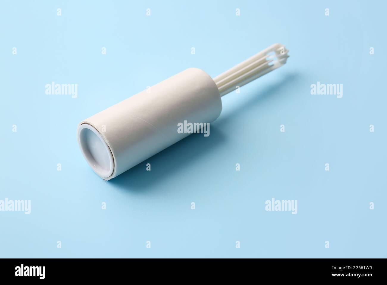 Blue lint roller removing hi-res stock photography and images - Alamy